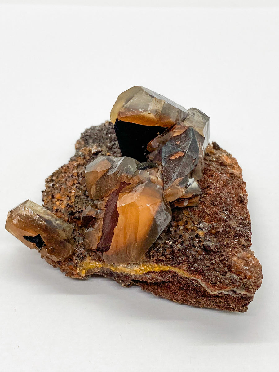 Iron Oxidized Quartz in Calcite – Crystals and Cleavage