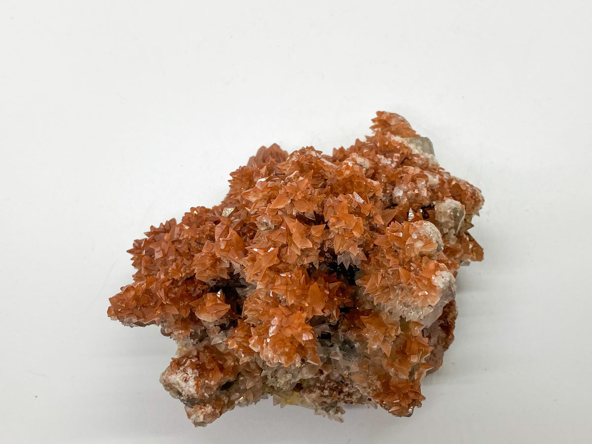 Red Dog Tooth Calcite on Quartz – Crystals and Cleavage