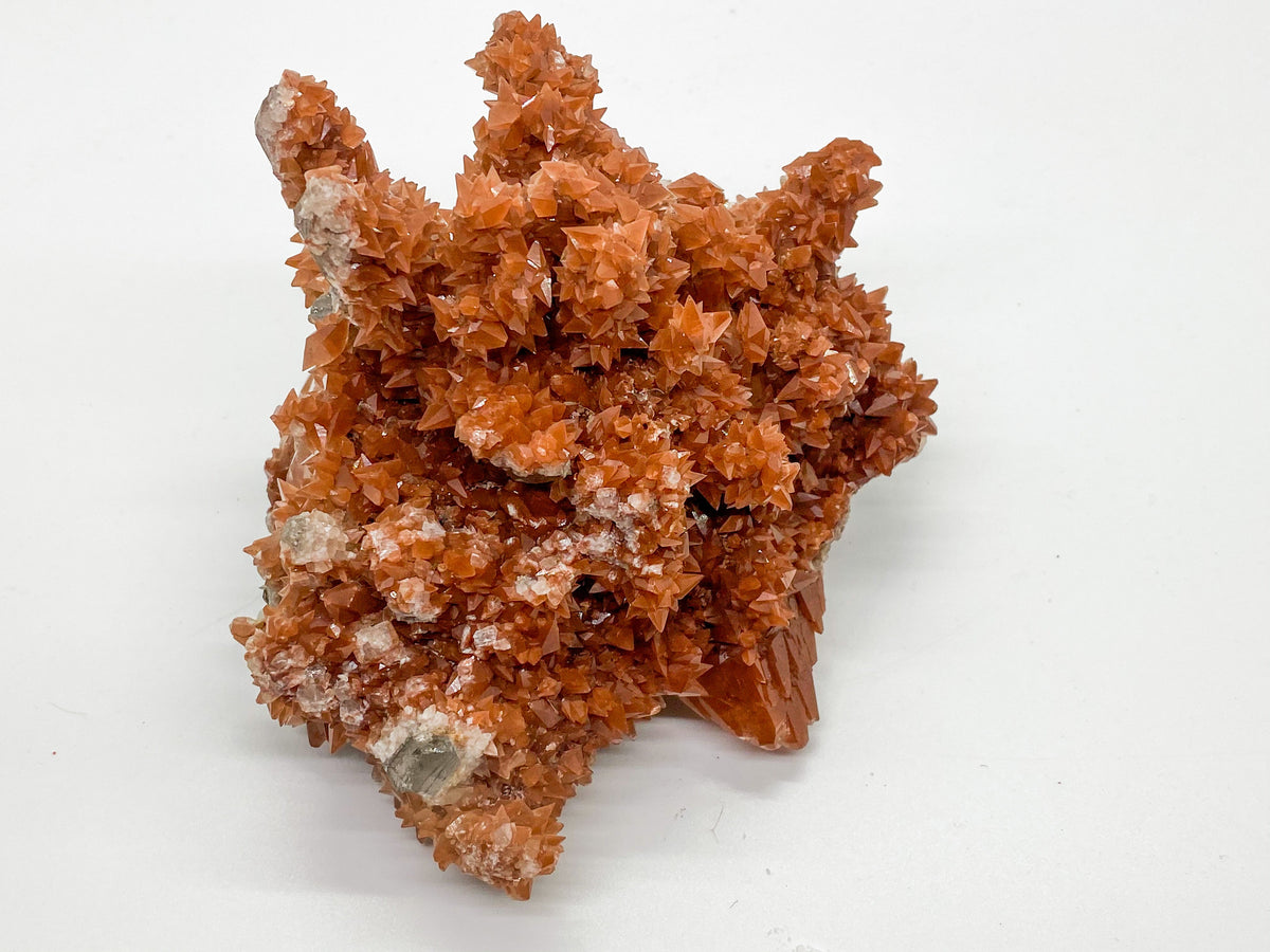 Red Dog Tooth Calcite on Quartz – Crystals and Cleavage